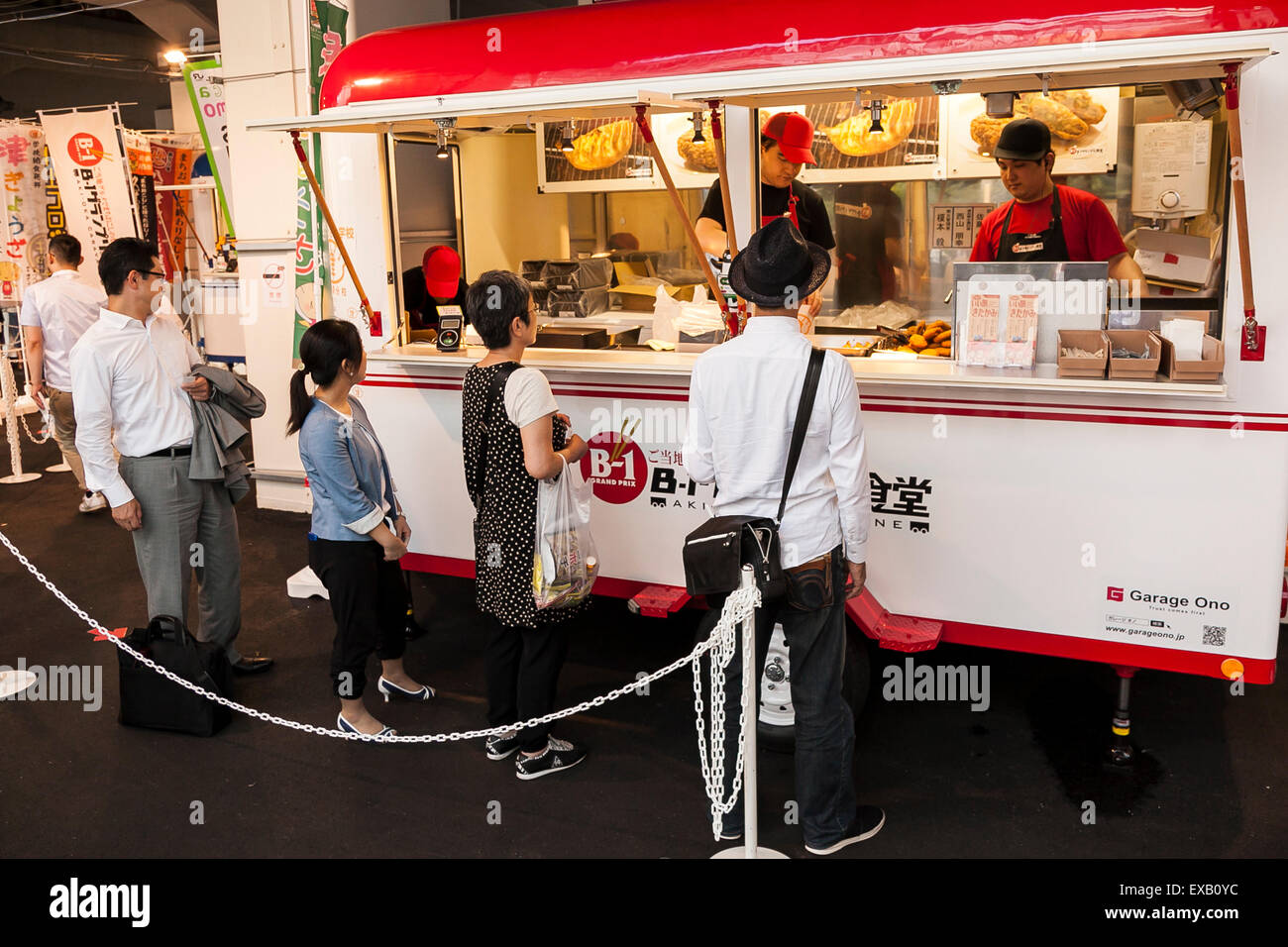 Customers wait in line to order their food at the ''B-1 Grand Prix Cafe ...