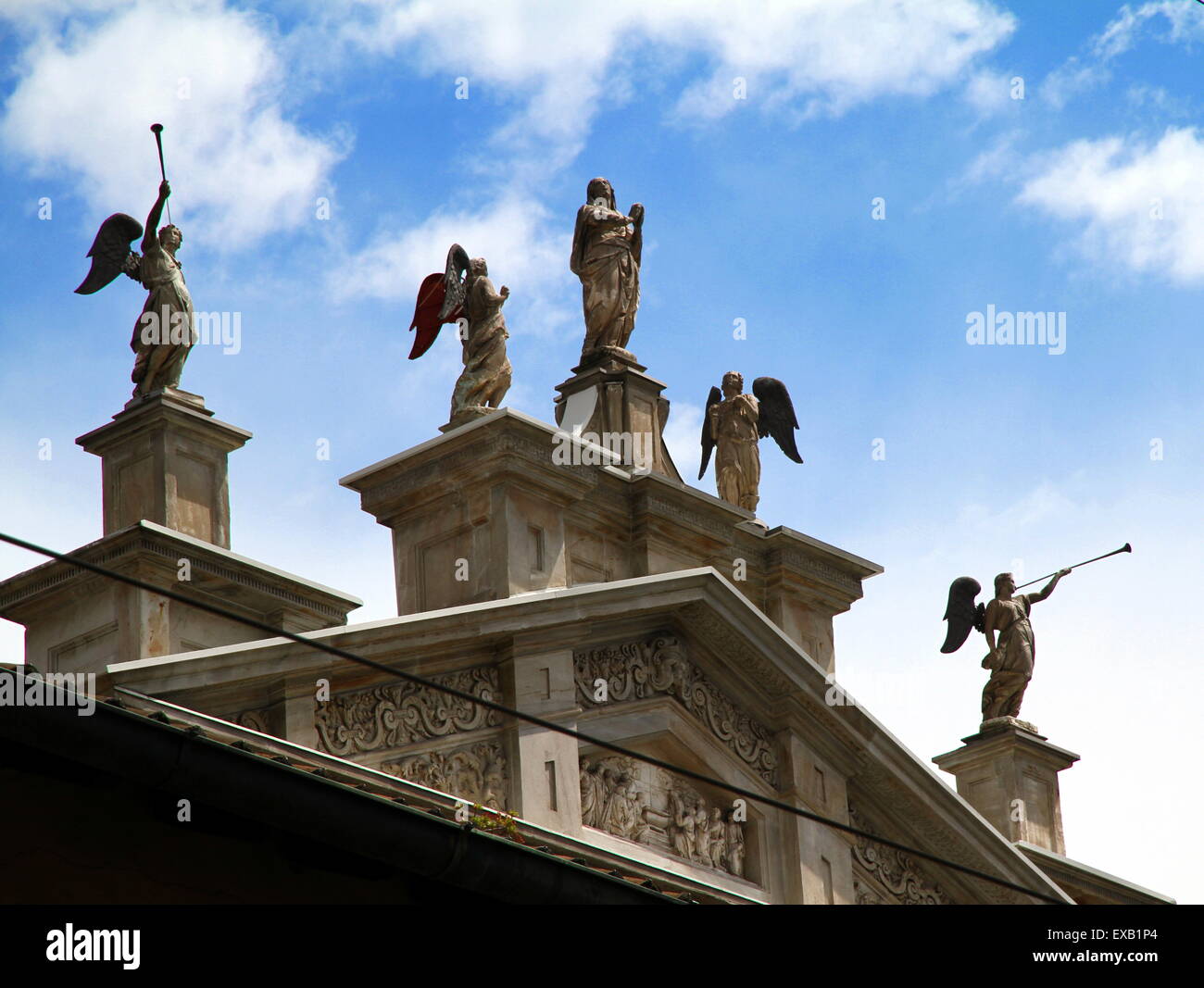 Saints and divine statues on the top of a church in Milan, Italy Stock ...
