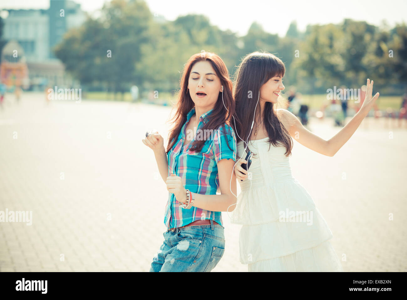 Fashionable women dancing together hi-res stock photography and images ...