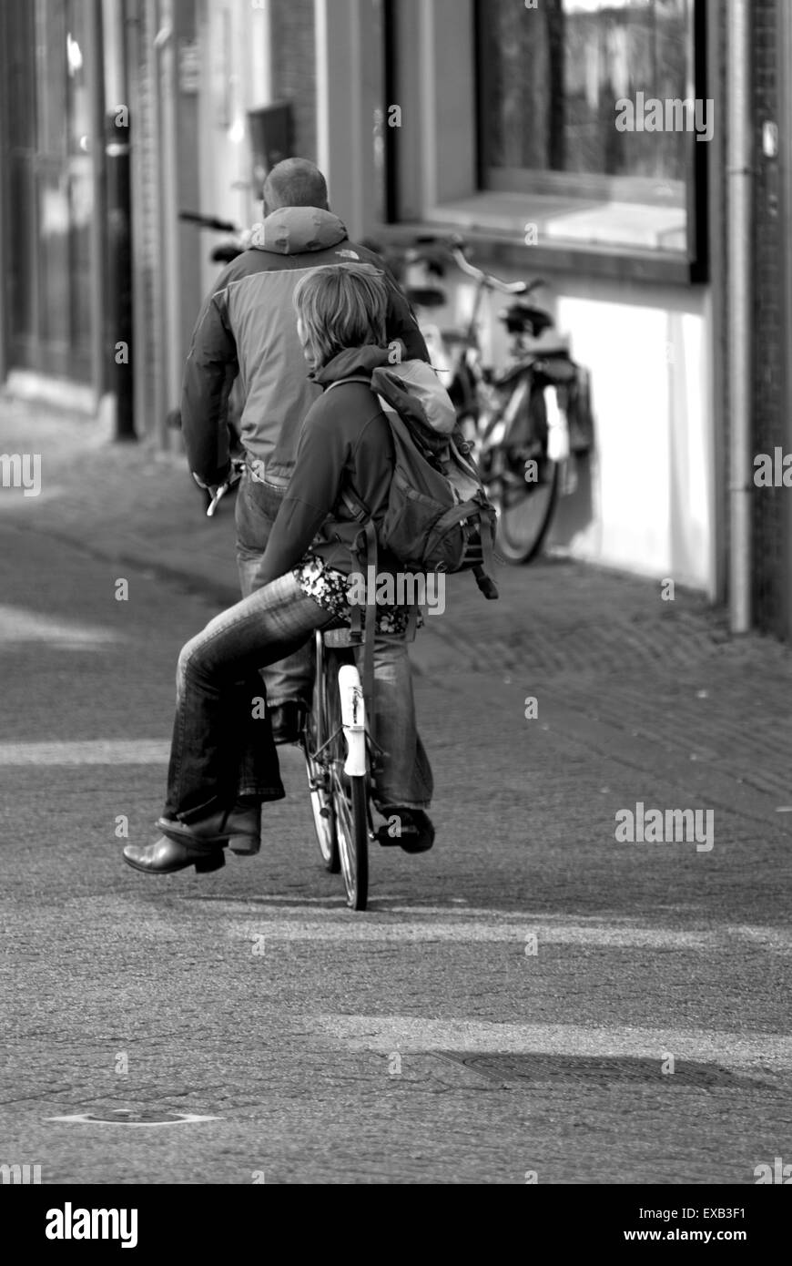Cyclist carrying passenger. Utrecht, The Netherlands Stock Photo - Alamy