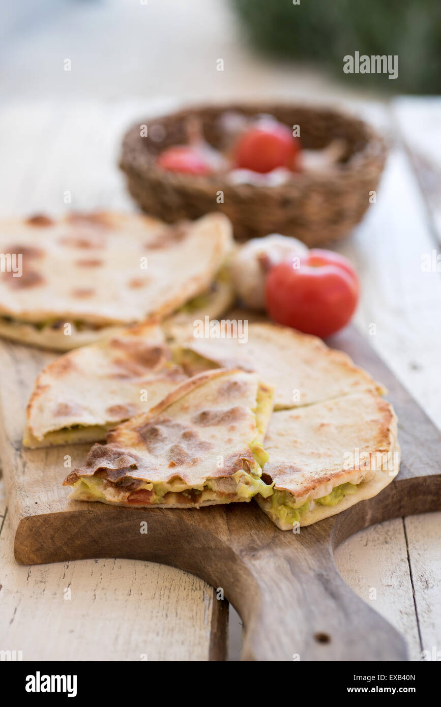 Delicious flatbreads with vegetable and avocado filling Stock Photo - Alamy