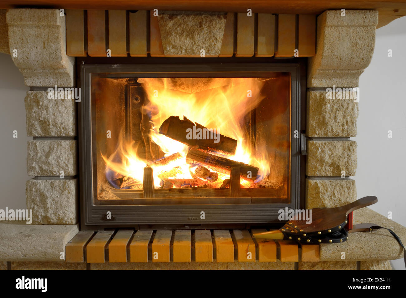 crest of flame on burning wood in fireplace Stock Photo - Alamy
