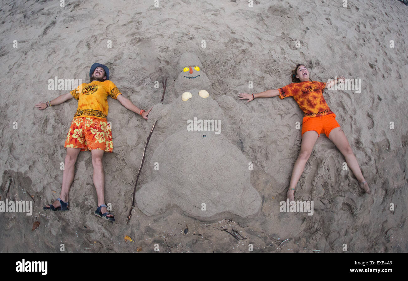 Smiling sandy snowman on the sea beach Stock Photo - Alamy