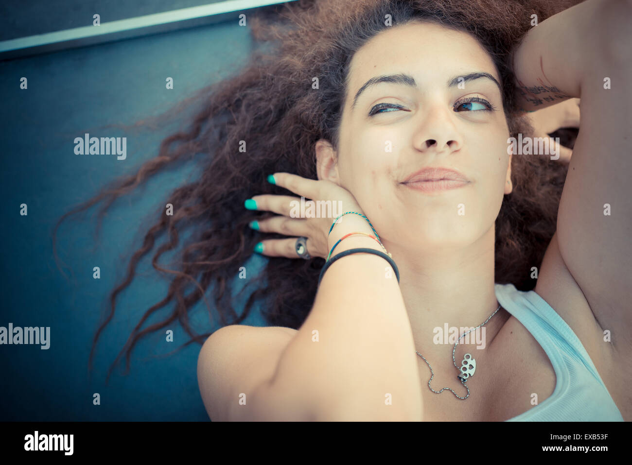 young beautiful long curly hair hipster woman in the city Stock Photo - Alamy