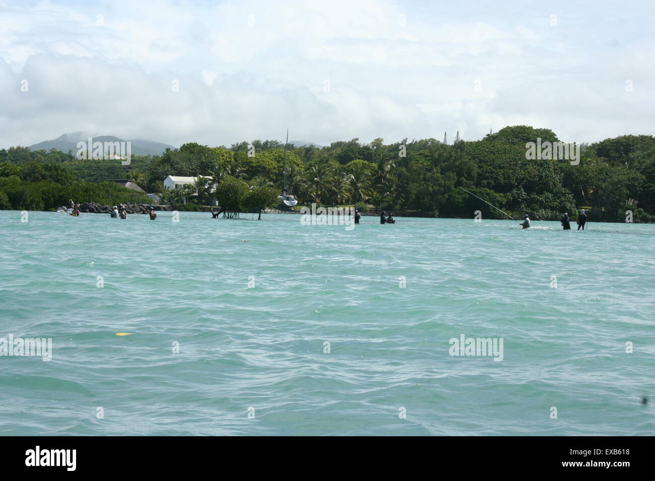 great sea with people fishing Stock Photo - Alamy