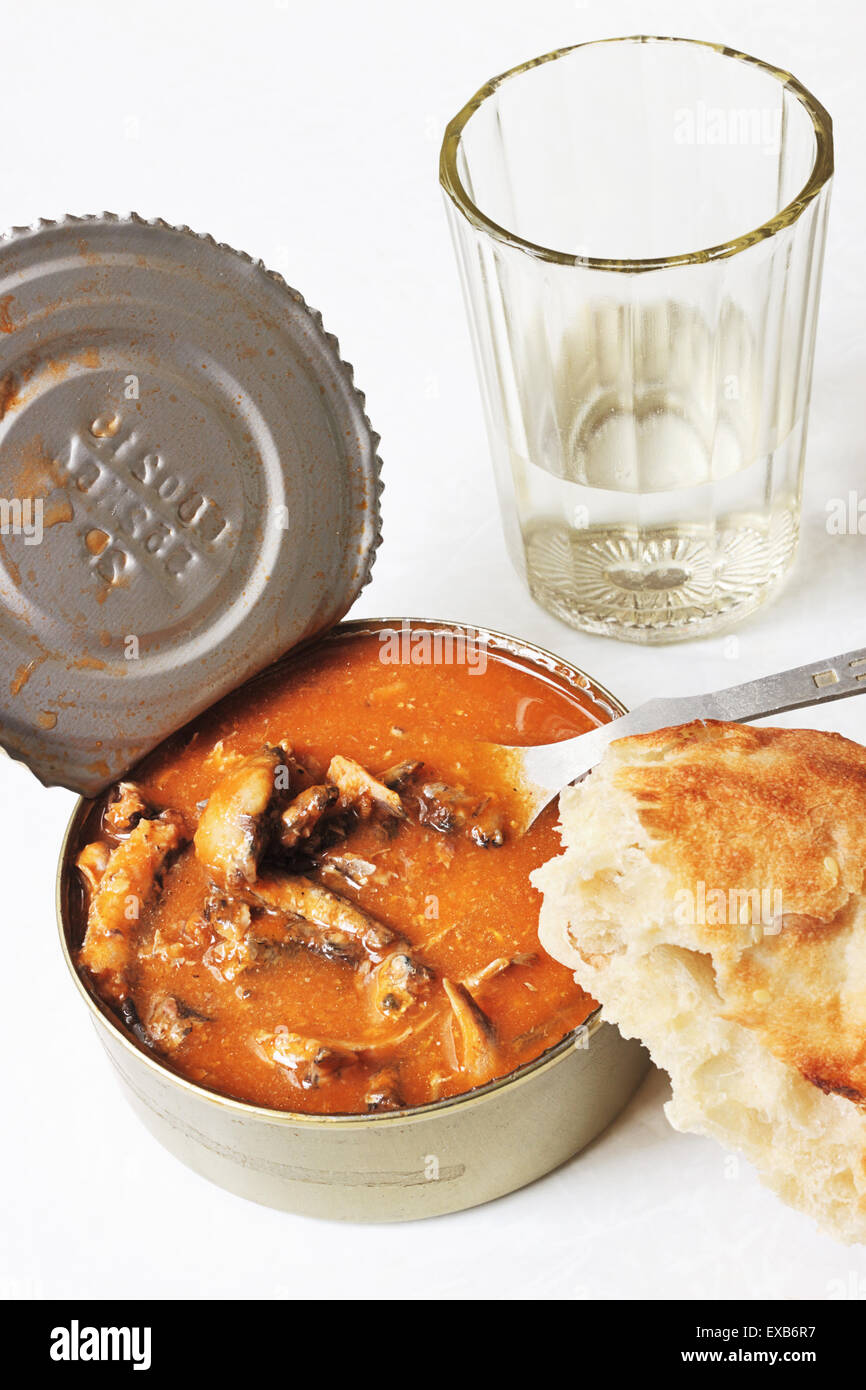 Russian snack food. Sprat in tomato sauce and vodka Stock Photo - Alamy