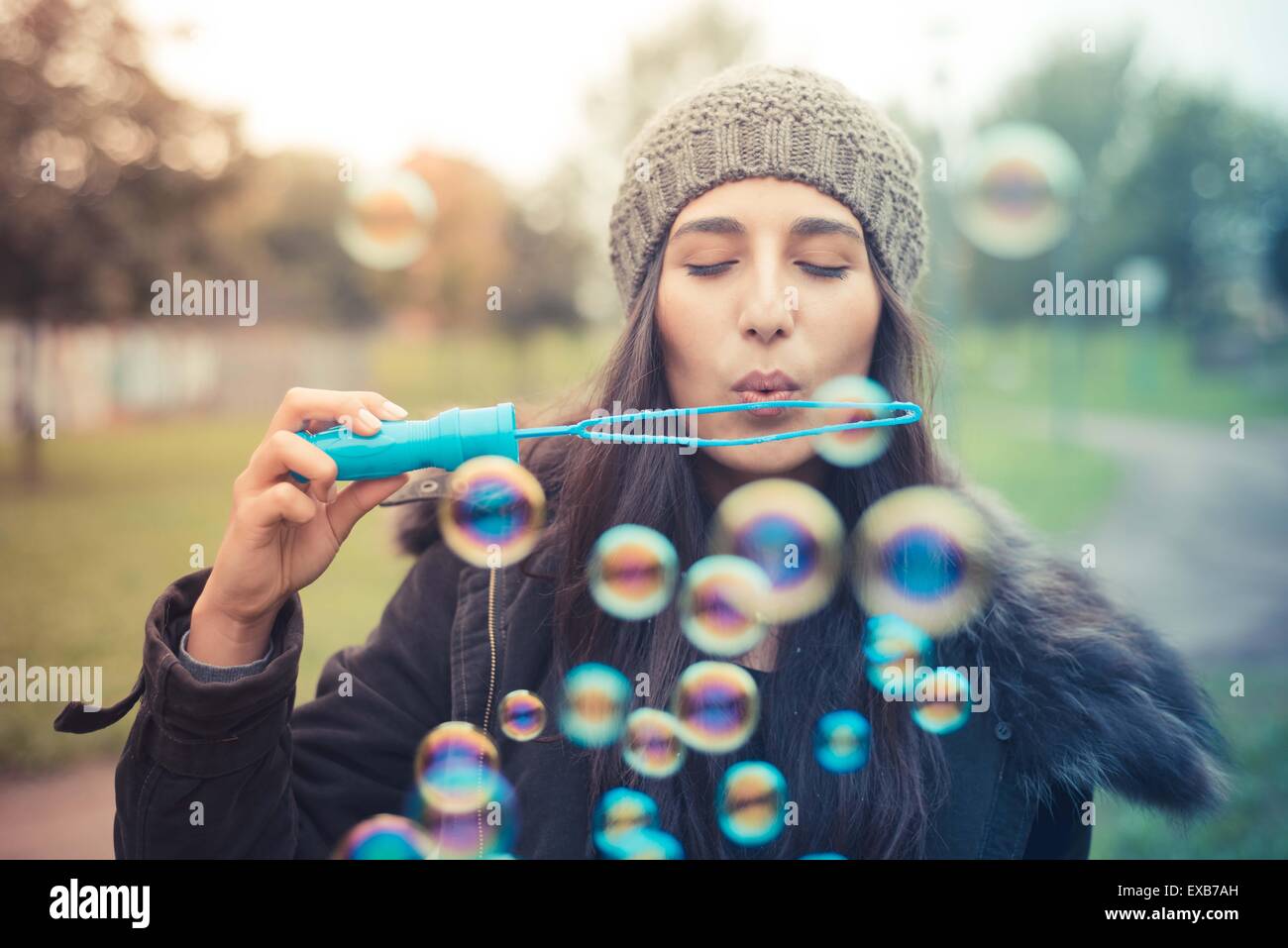 Beautiful female blowing bubbles hi-res stock photography and images - Alamy