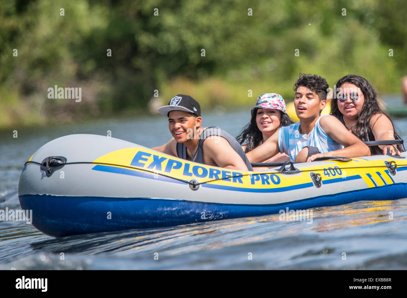 Floating the Boise river, Latino family having fun rafting the River ...