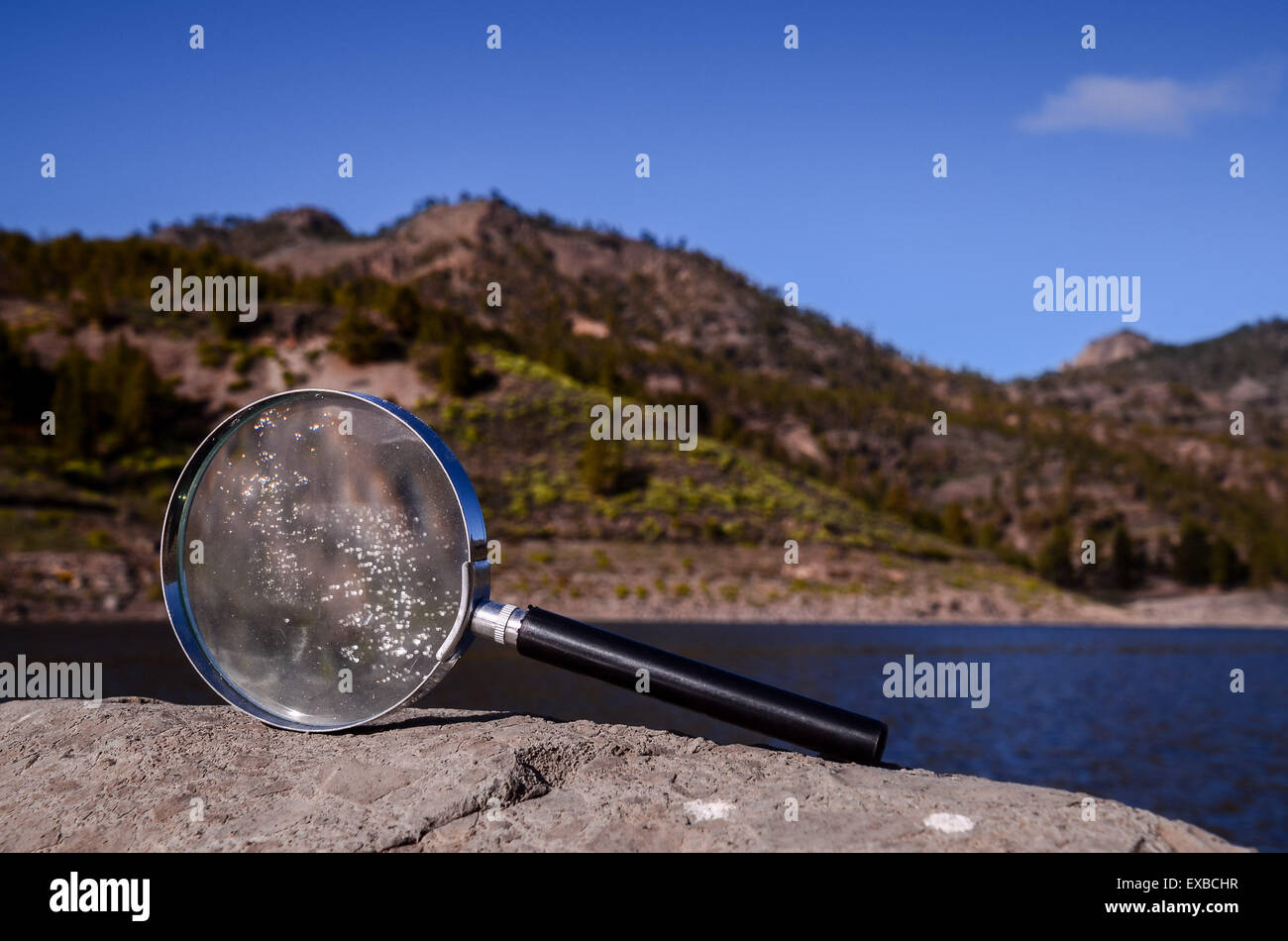Magnify Glass Loupe on the Volcanic Rock Stock Photo - Alamy