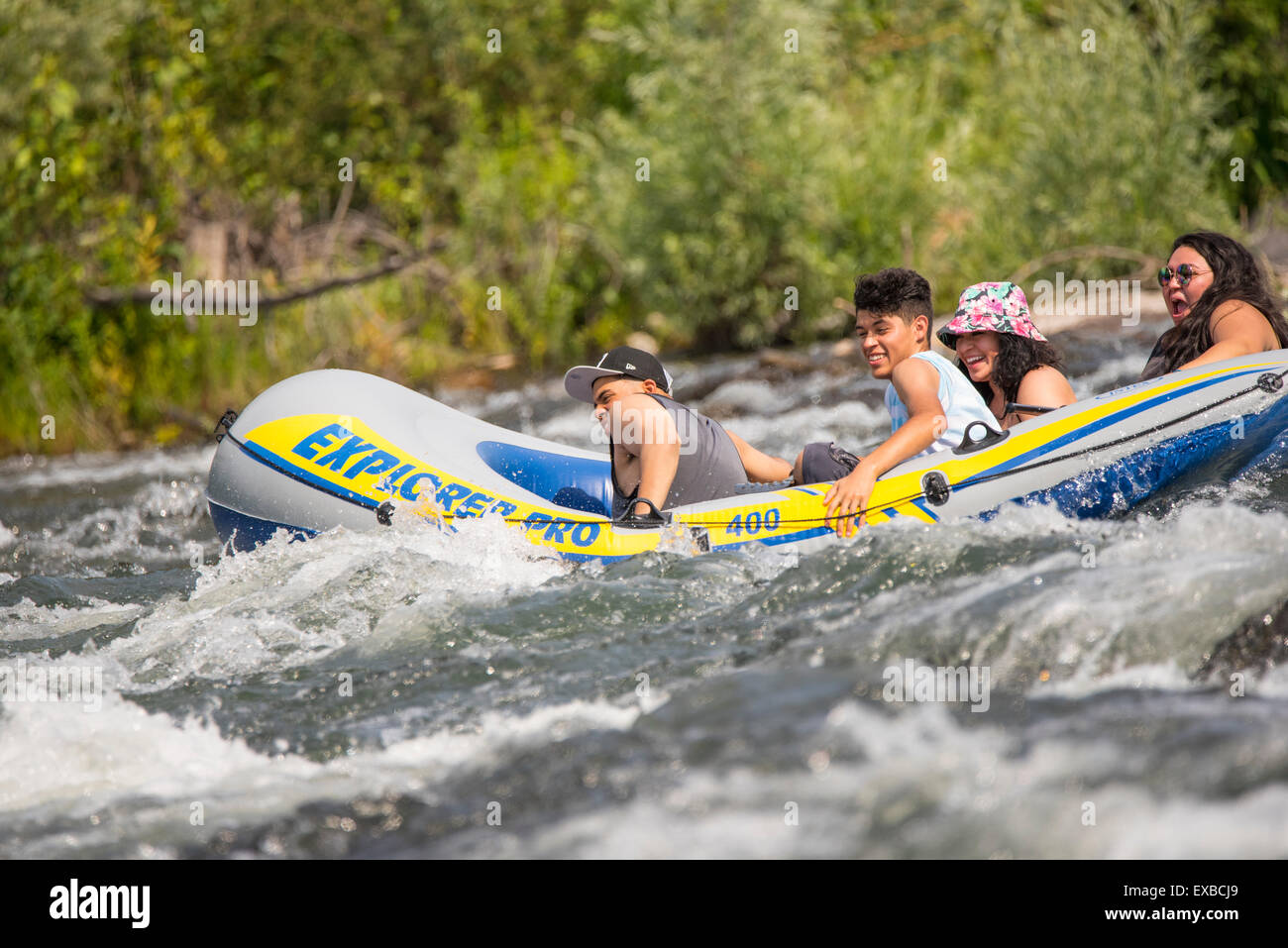 Floating the Boise river, Latino family having fun rafting the River ...