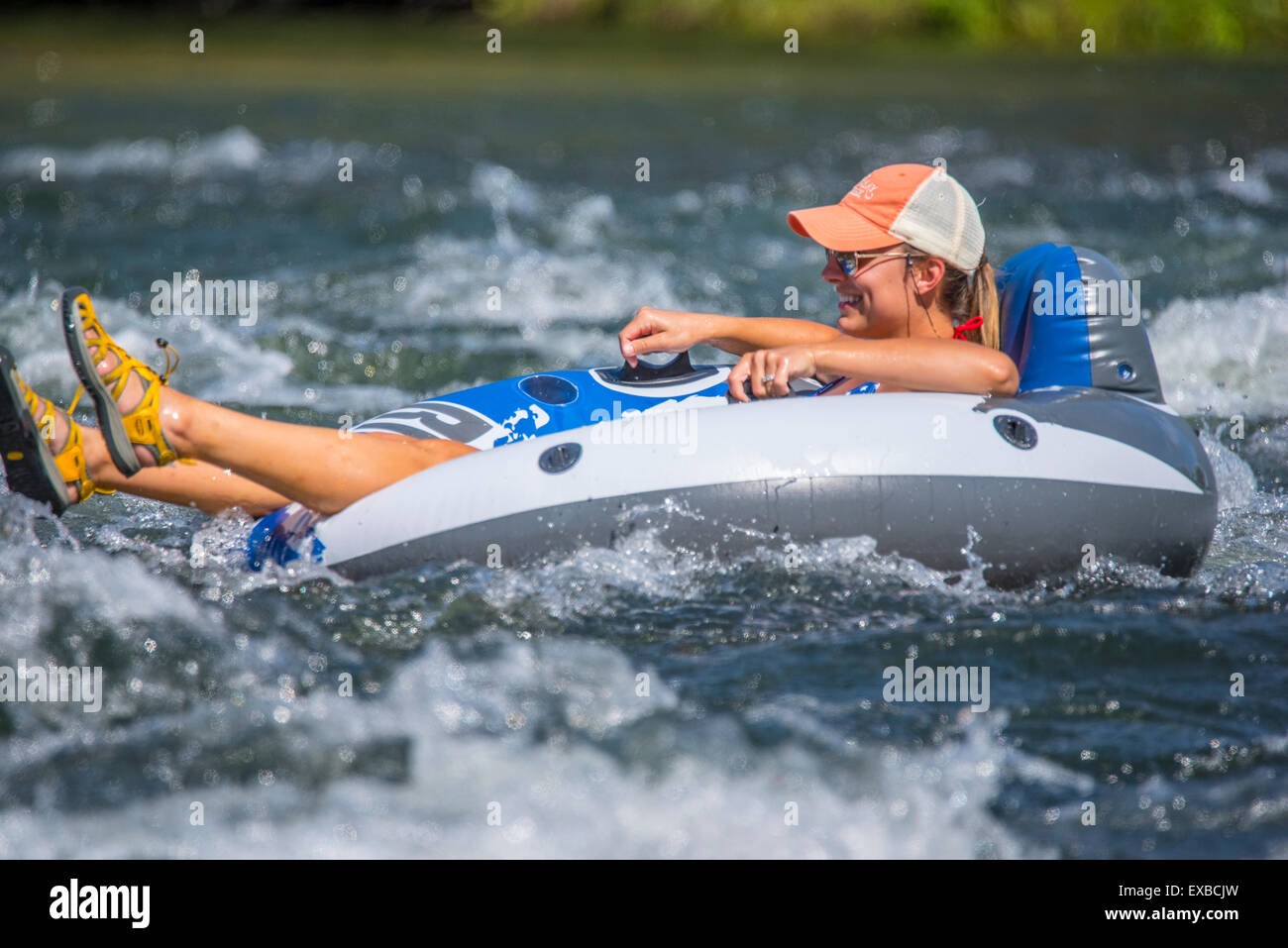 Floating the Boise River, Woman enjoying tubing through rapids. Boise ...