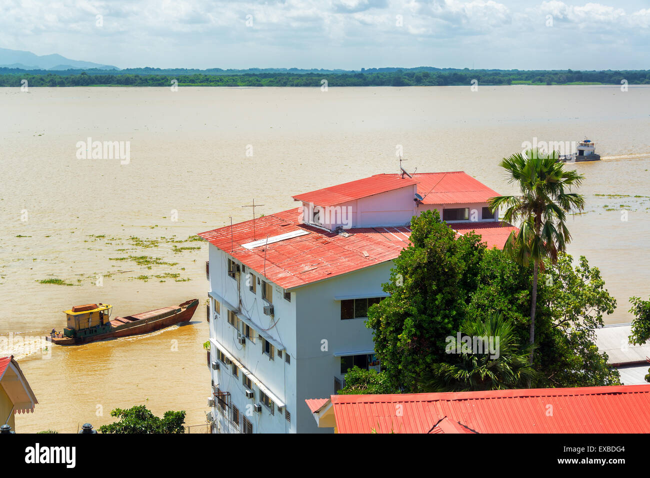 View of a building in Guayaquil, Ecuador with boats on the Guayas River ...