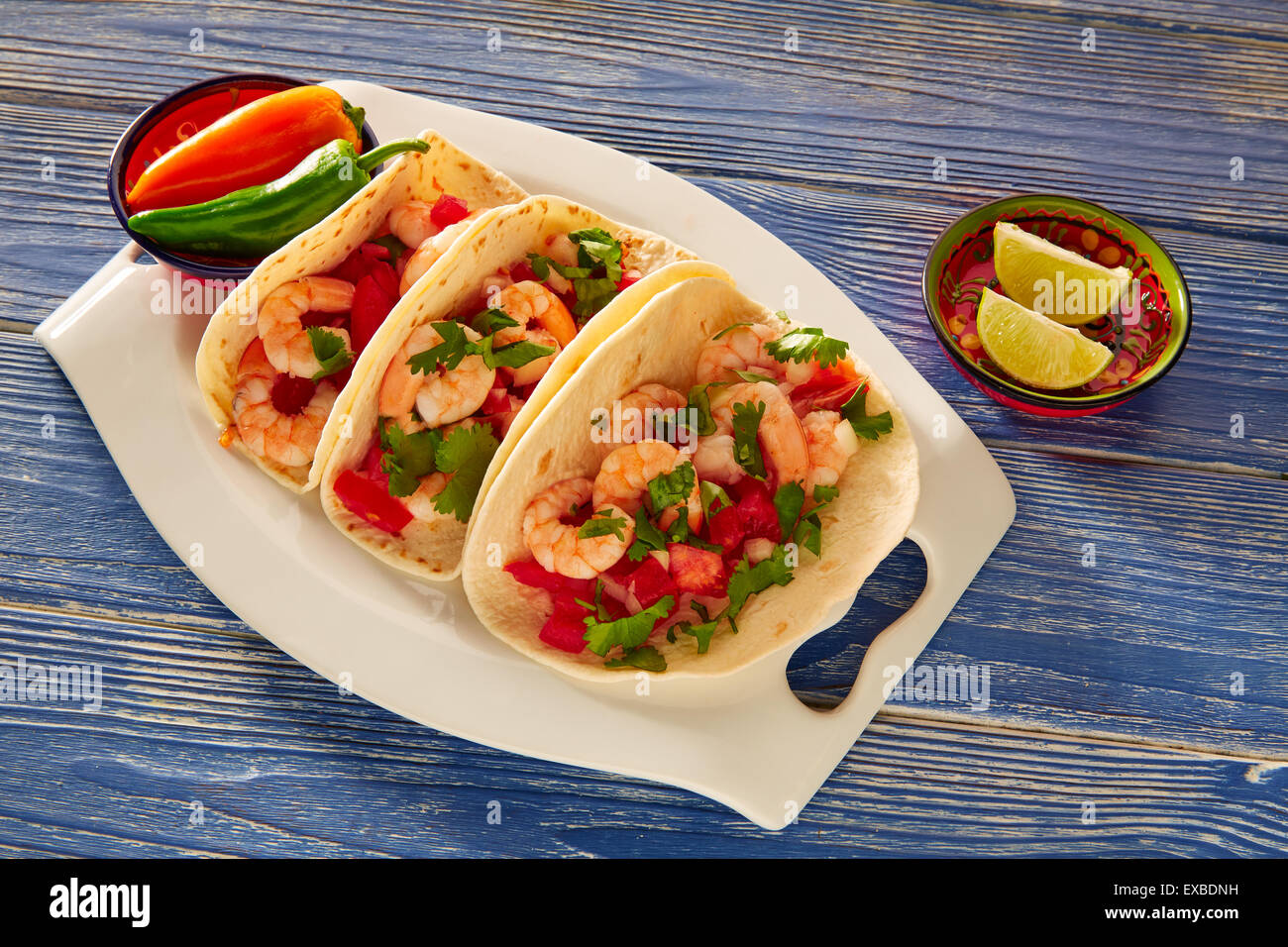 Camaron shrimp tacos mexican food on blue wood table Stock Photo - Alamy