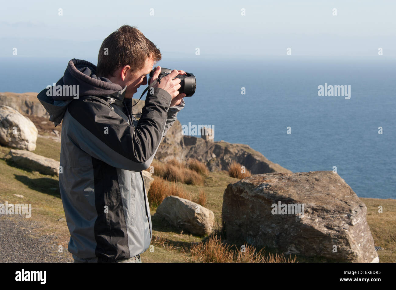 Boy taking pictures in Ireland Stock Photo - Alamy