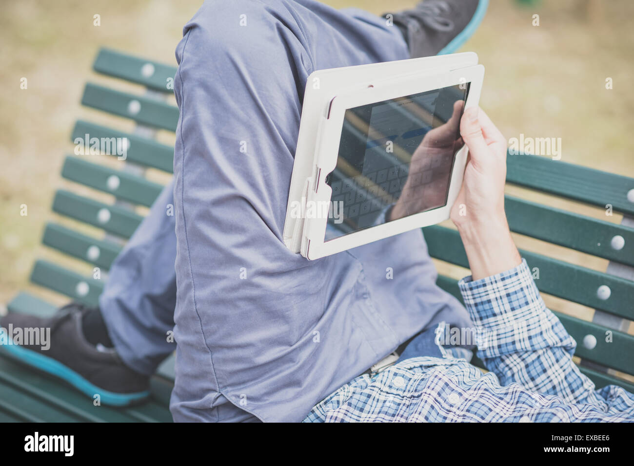 Man using tablet lying hi-res stock photography and images - Alamy