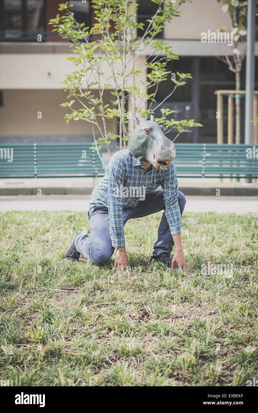 hippo mask absurd man in the city Stock Photo - Alamy
