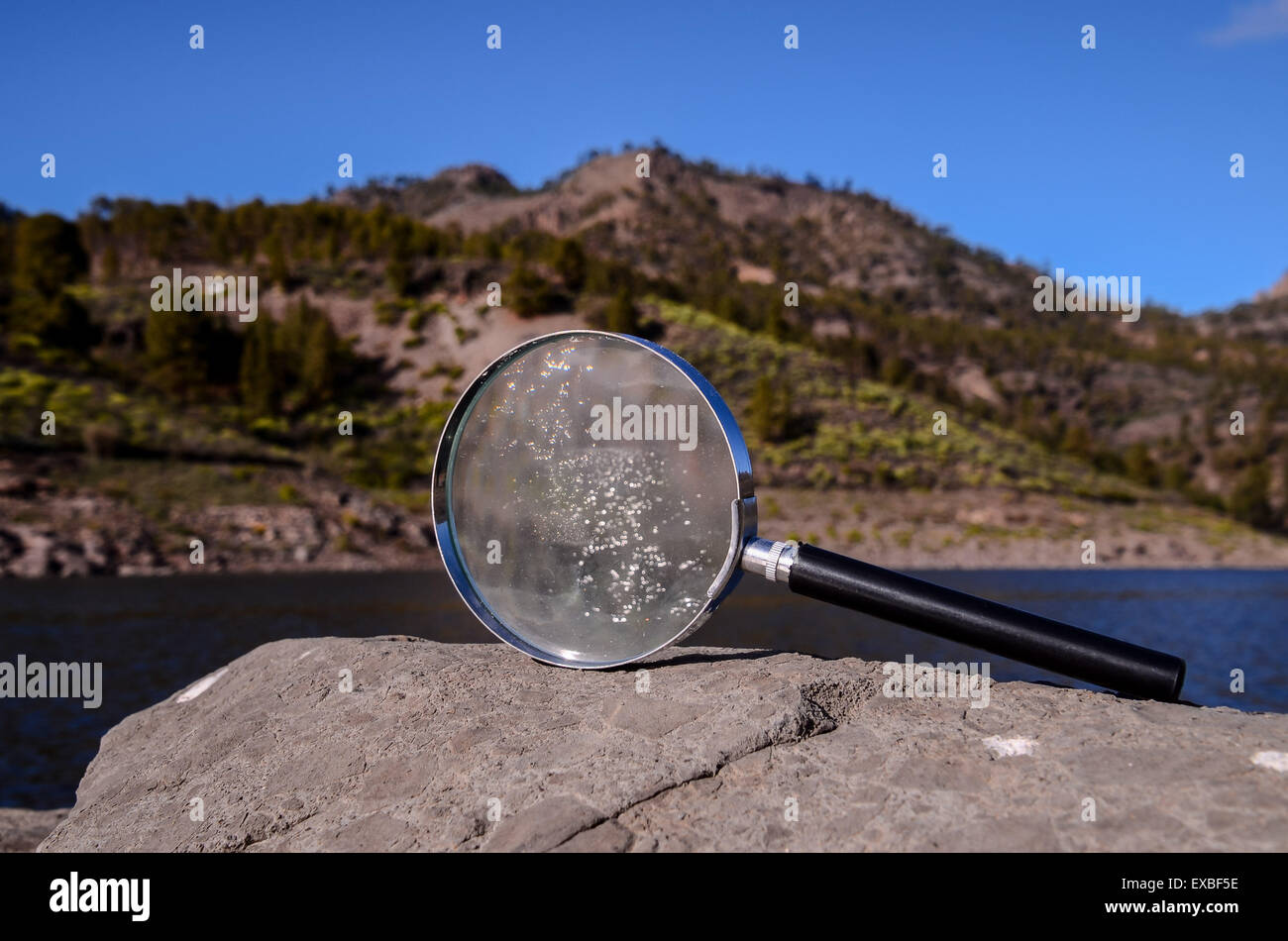 Magnify Glass Loupe on the Volcanic Rock Stock Photo - Alamy