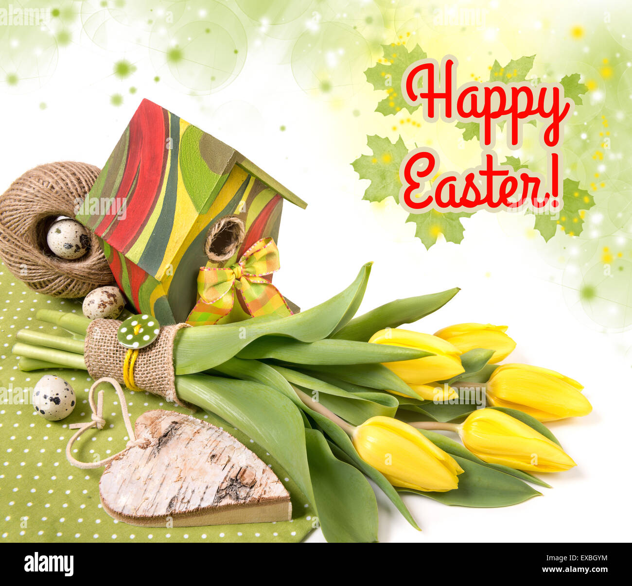 Easter border with yellow tulips and natural decorations on white ...