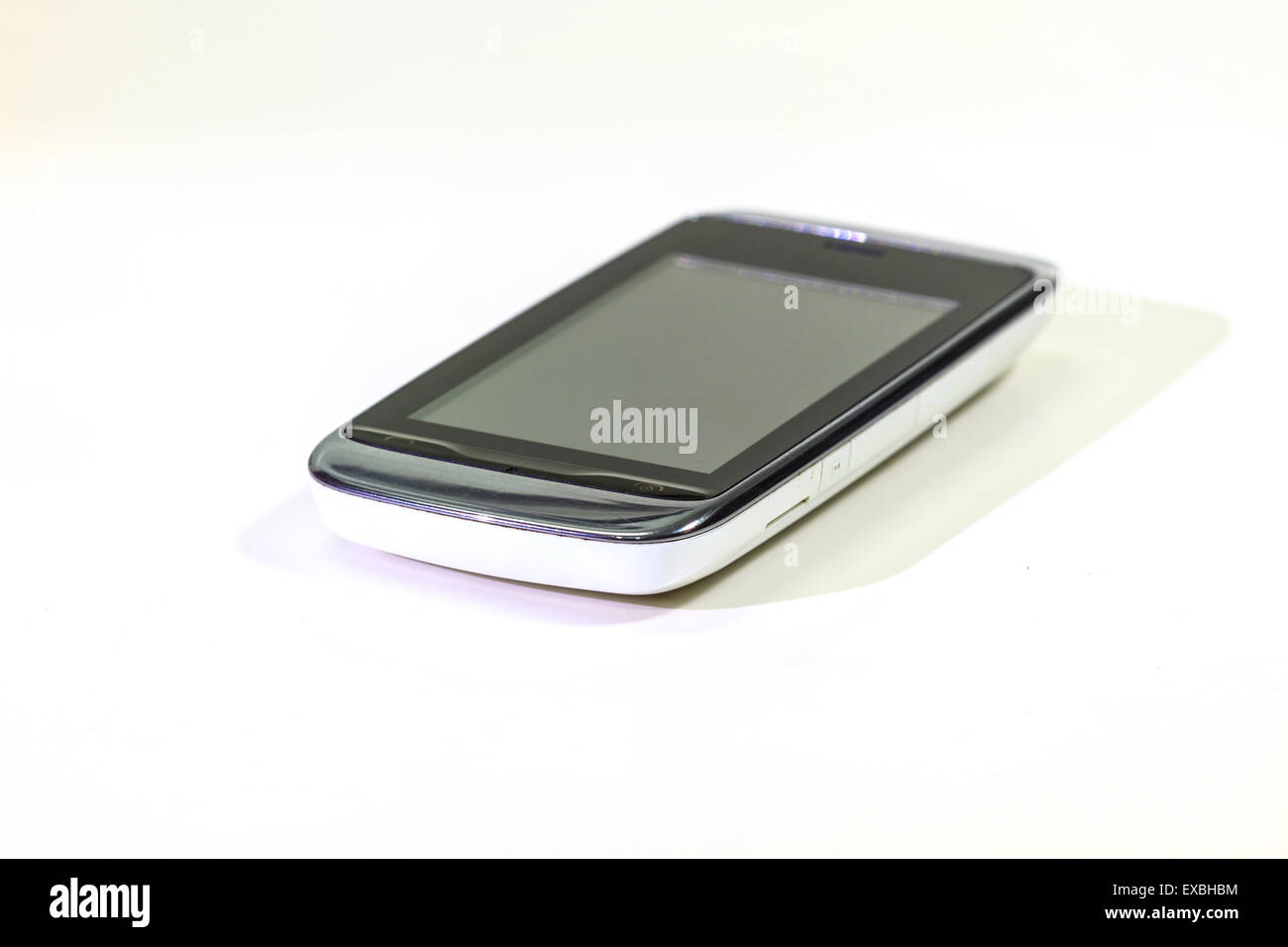 Old Mobile phone used with blank screen for copy space on white Stock ...