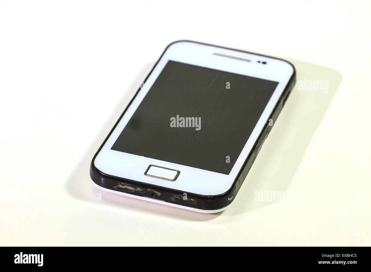 Old Mobile phone used with blank screen for copy space on white Stock ...