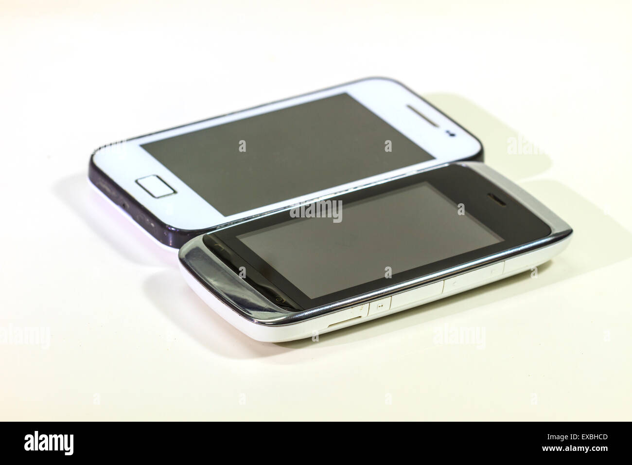 Old Mobile phone used with blank screen for copy space on white Stock ...