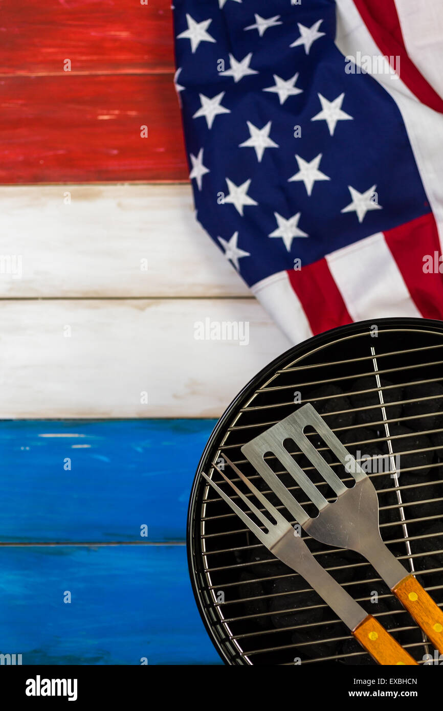 Small round charcoal grill ready for grilling at the summer picnic ...