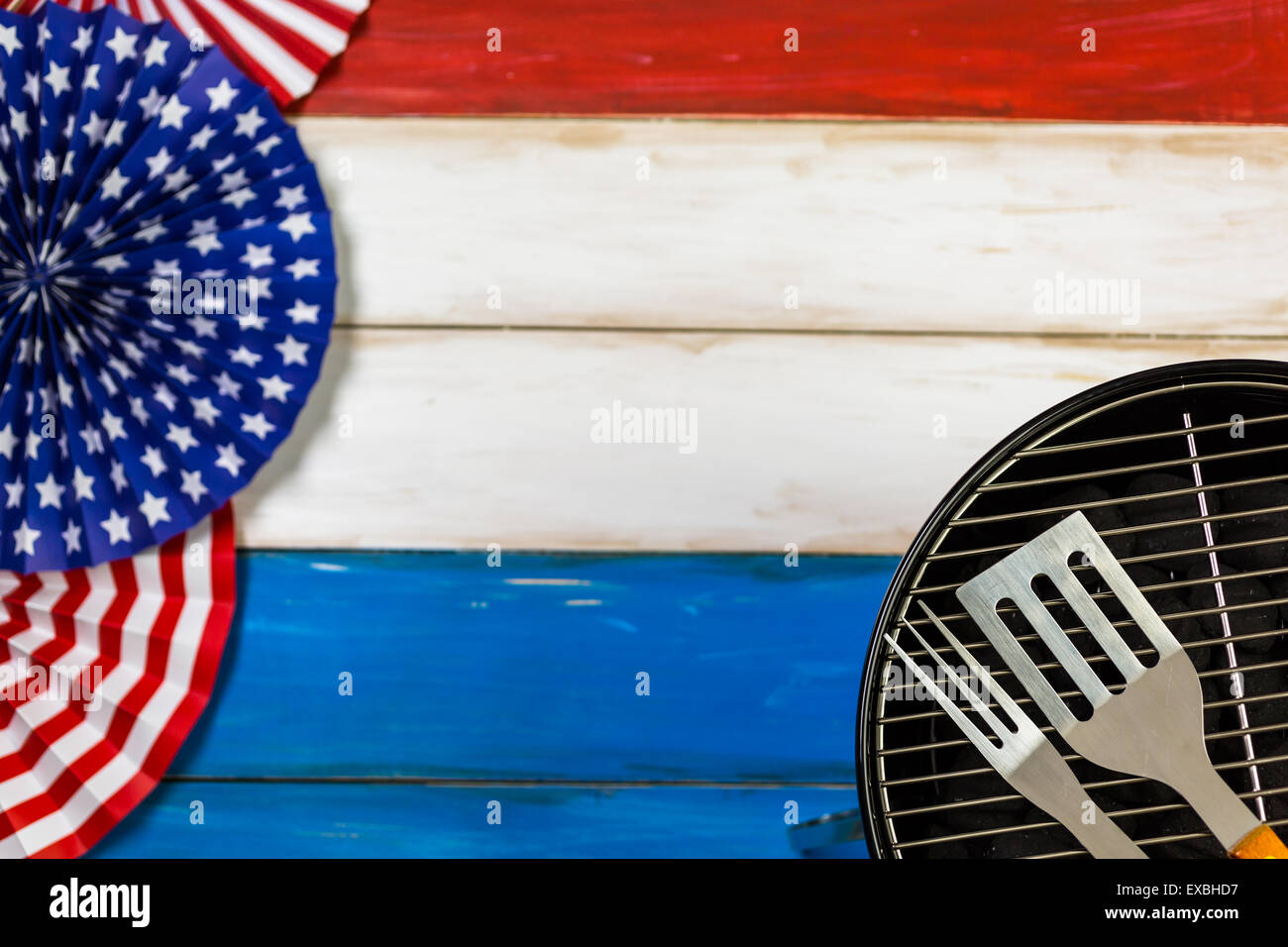 Small round charcoal grill ready for grilling at the summer picnic ...