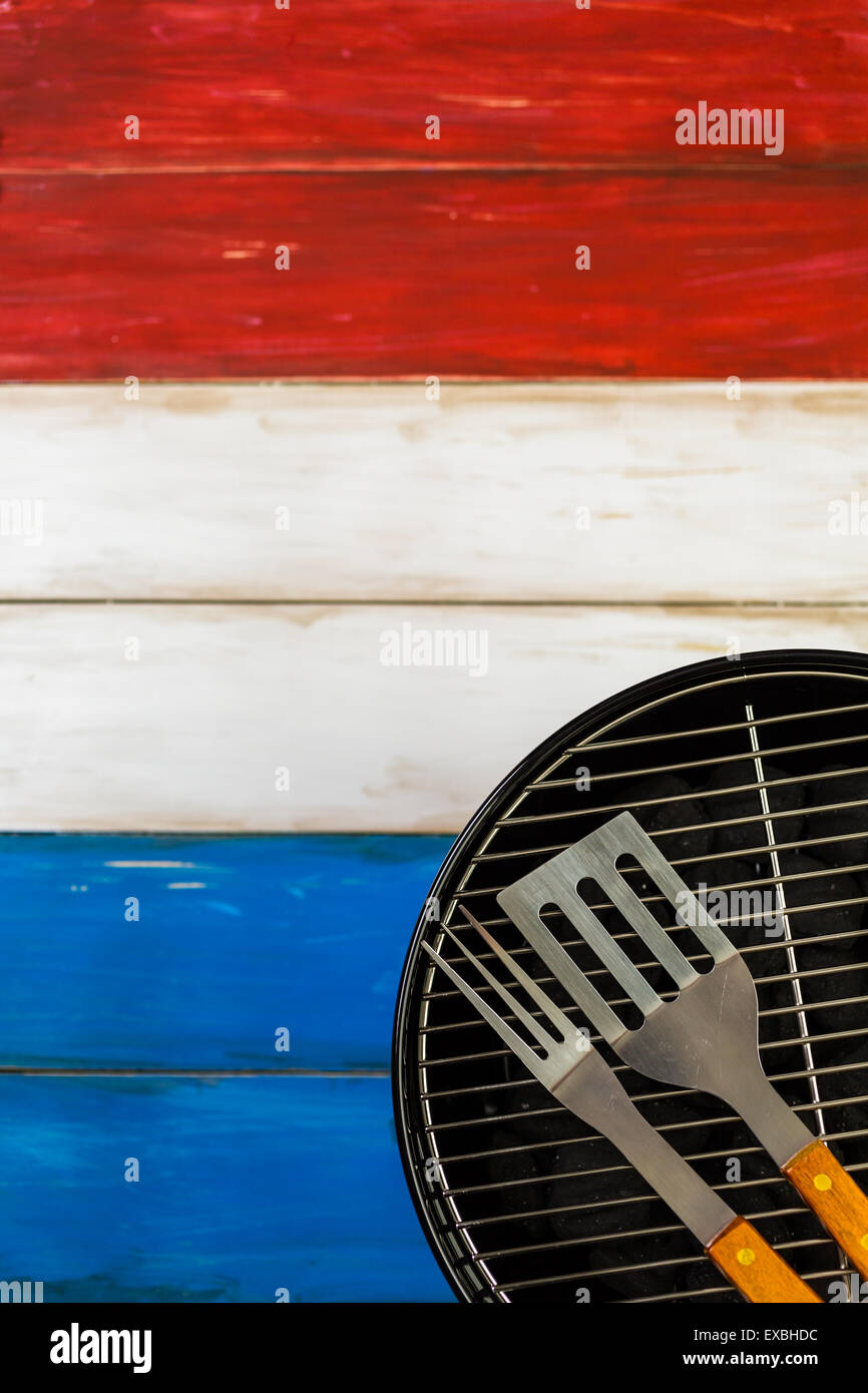 Small round charcoal grill ready for grilling at the summer picnic ...