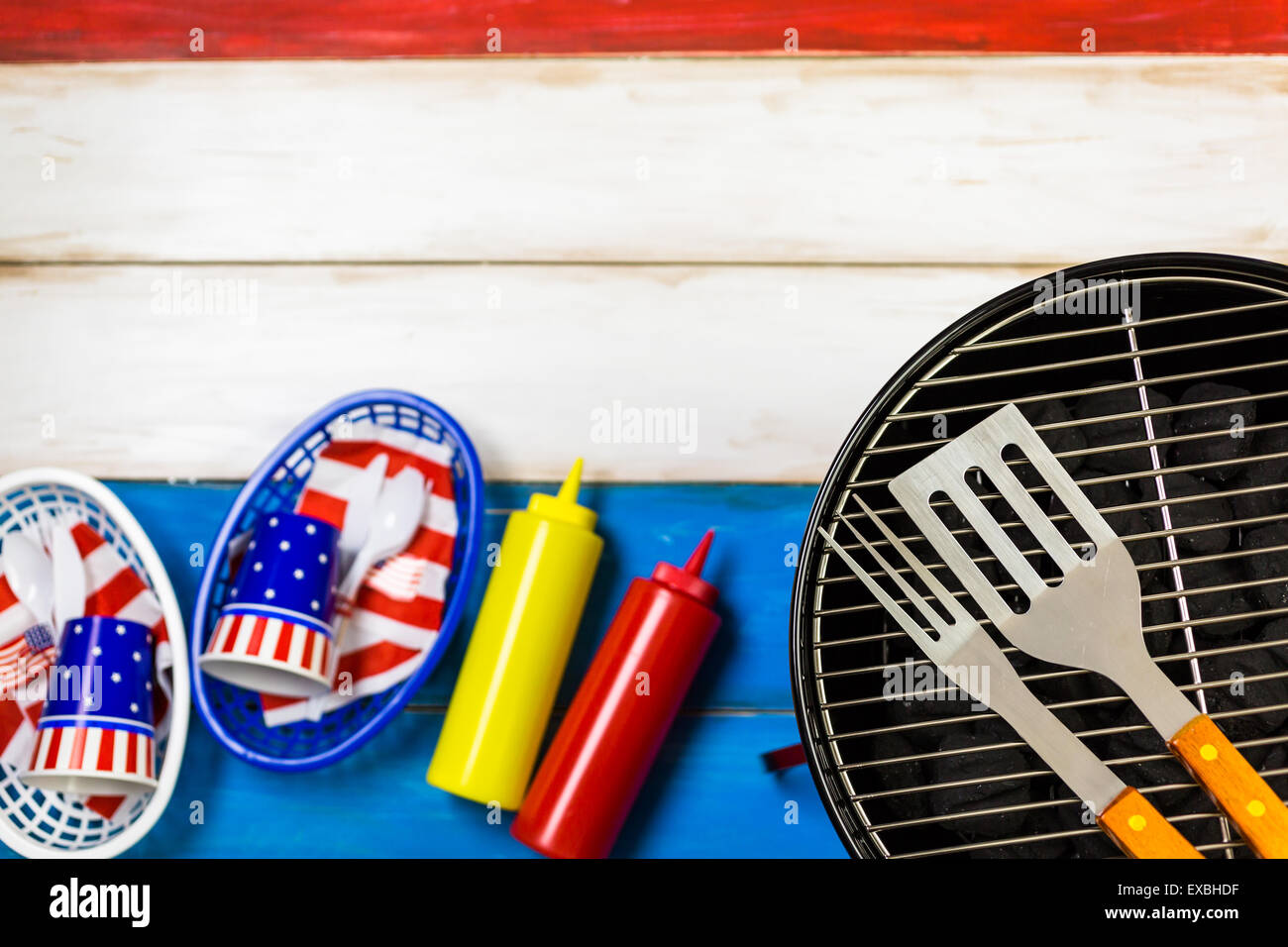 Small round charcoal grill ready for grilling at the summer picnic ...