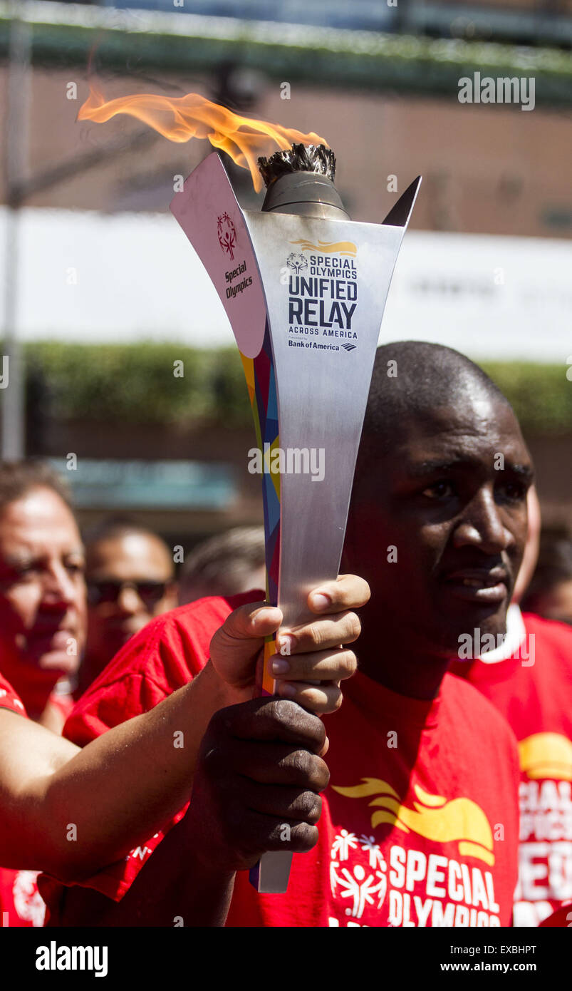 Los Angeles, California, USA. 10th July, 2015. Torch bearers carrying ...