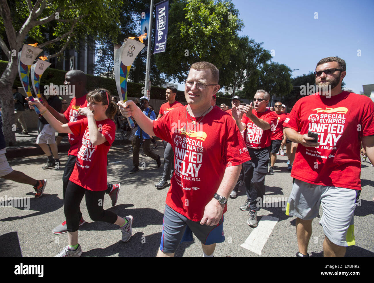 Los Angeles, California, USA. 10th July, 2015. Torch bearers carrying ...