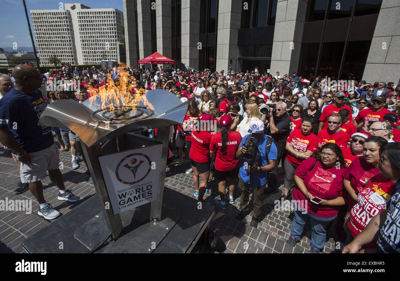 Los Angeles, California, USA. 10th July, 2015. Torch bearers carrying ...