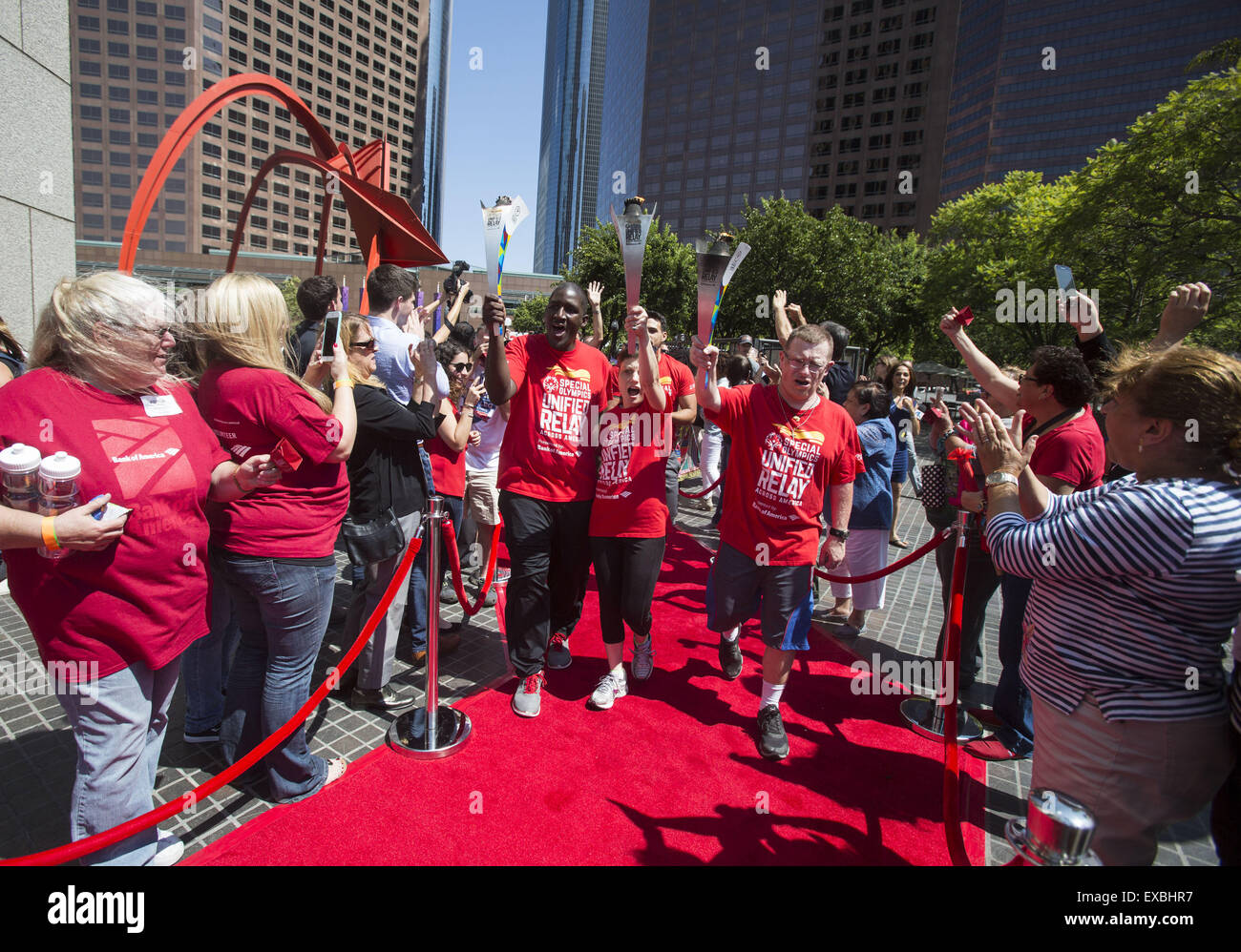 Los Angeles, California, USA. 10th July, 2015. Torch bearers carrying ...