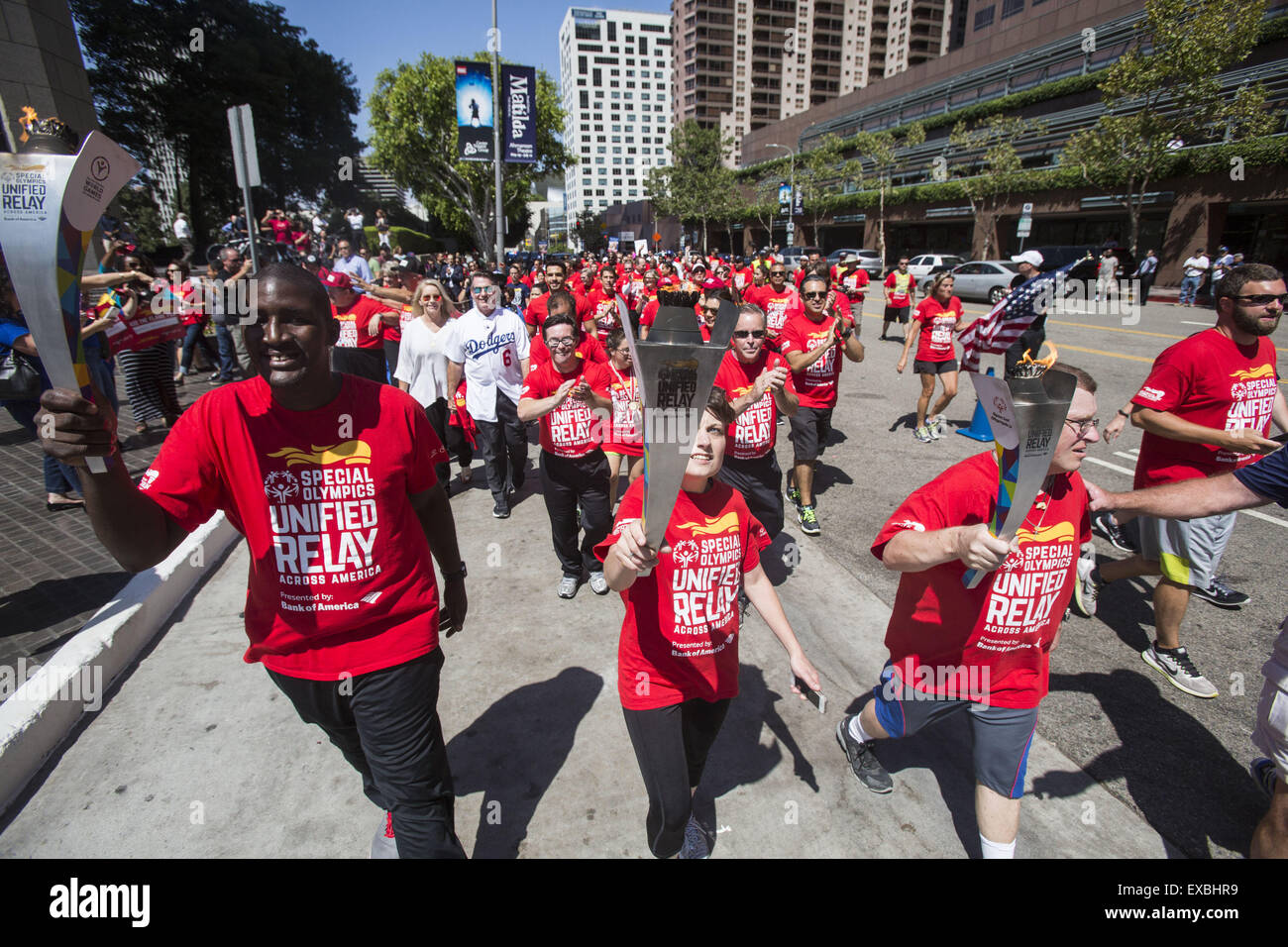 Los Angeles, California, USA. 10th July, 2015. Torch bearers carrying ...