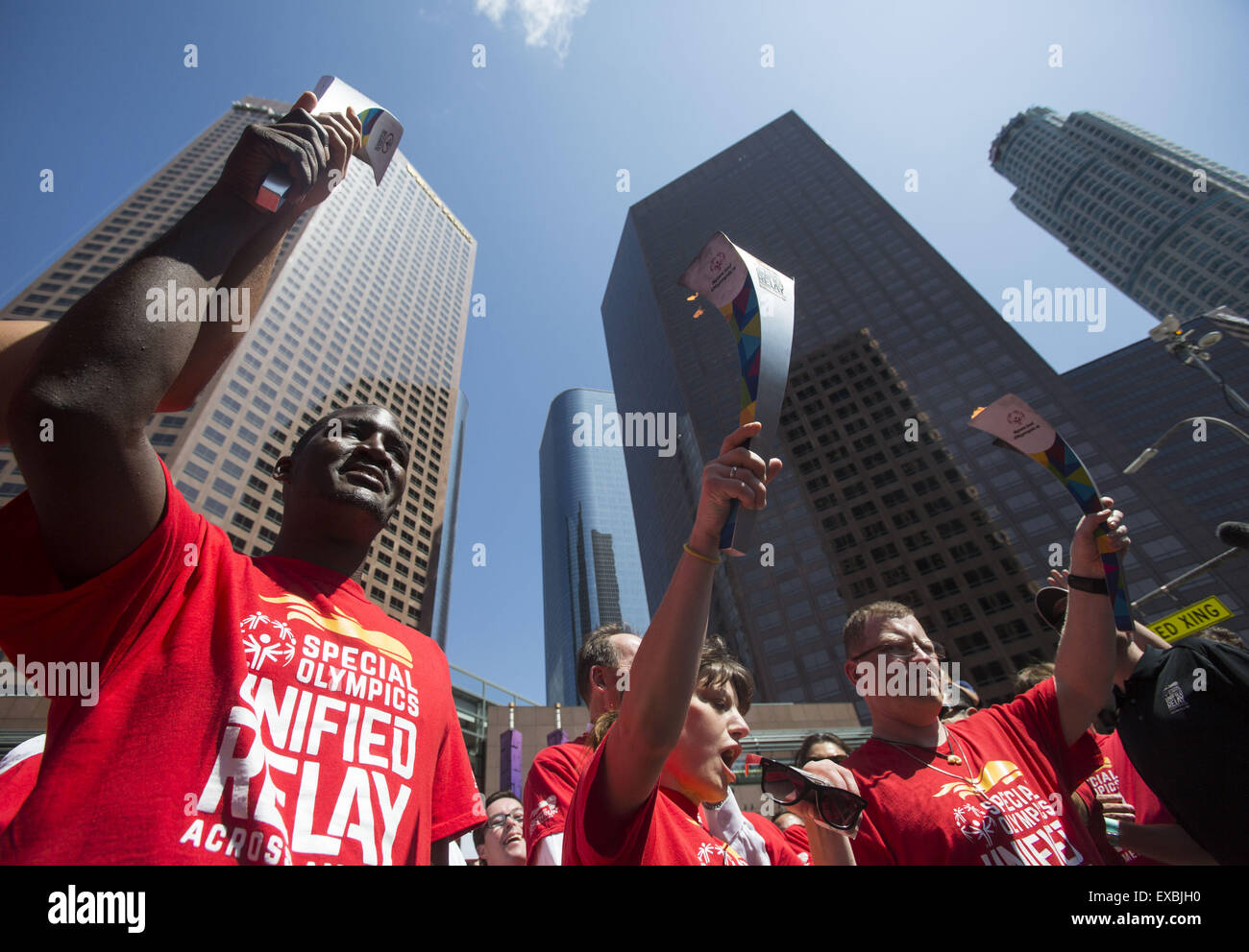Los Angeles, California, USA. 10th July, 2015. Torch bearers carrying ...