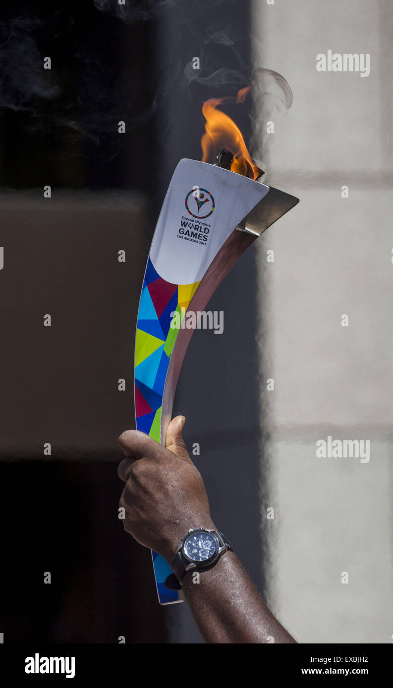 Los Angeles, California, USA. 10th July, 2015. Torch bearers carrying ...