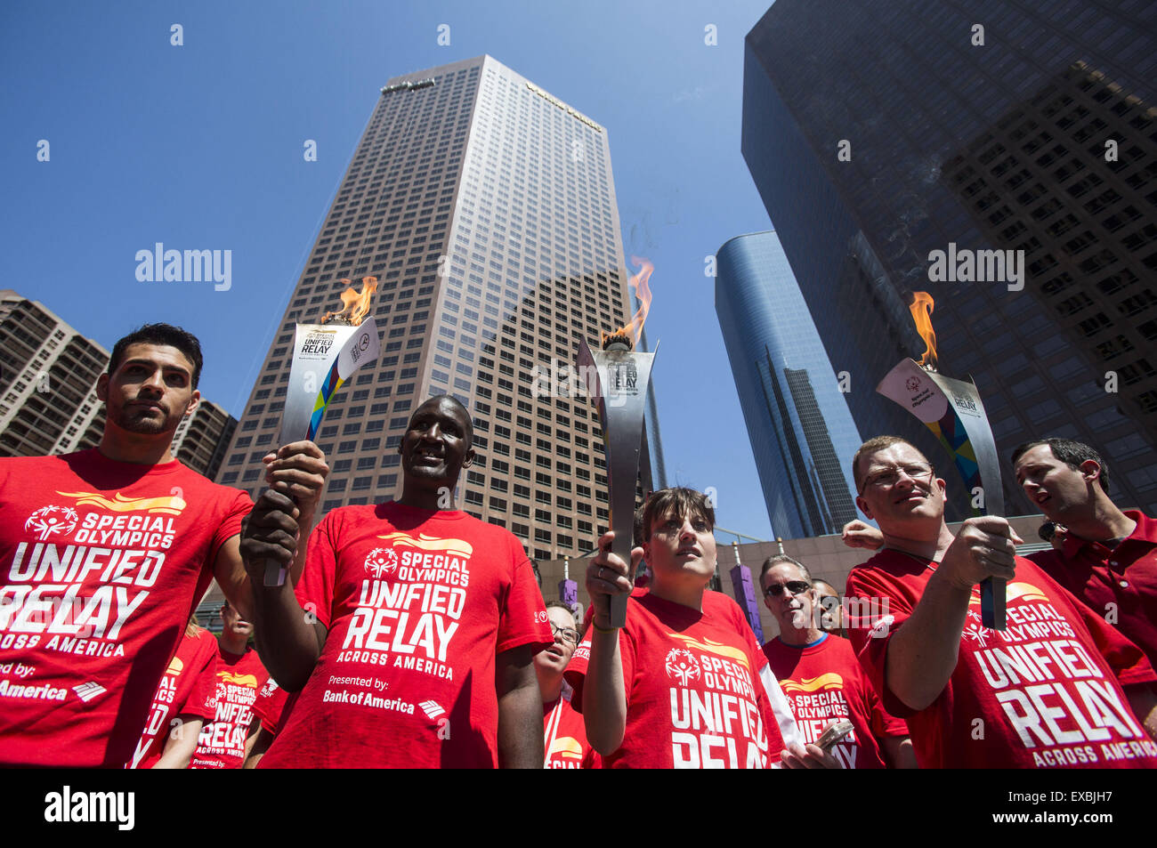 Los Angeles, California, USA. 10th July, 2015. Torch bearers carrying ...