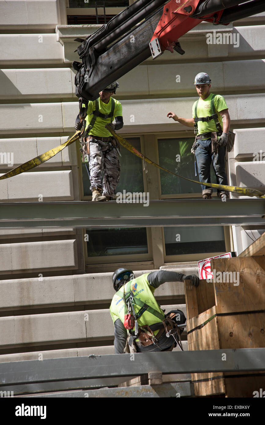 Dismantling and loading scaffolding girders onto a truck New York USA ...