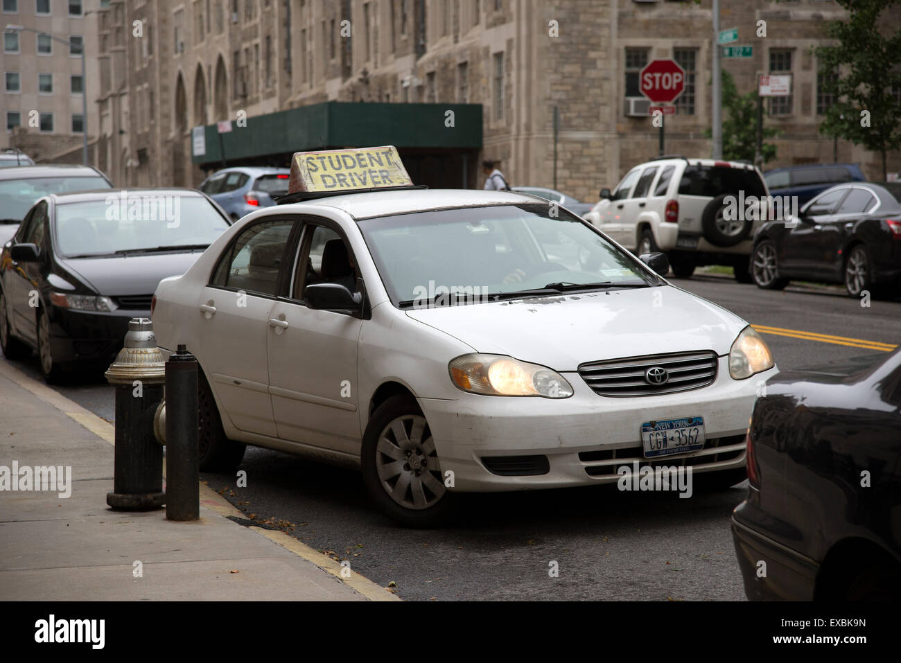 Student driver learning to drive in a busy New York Street USA ...