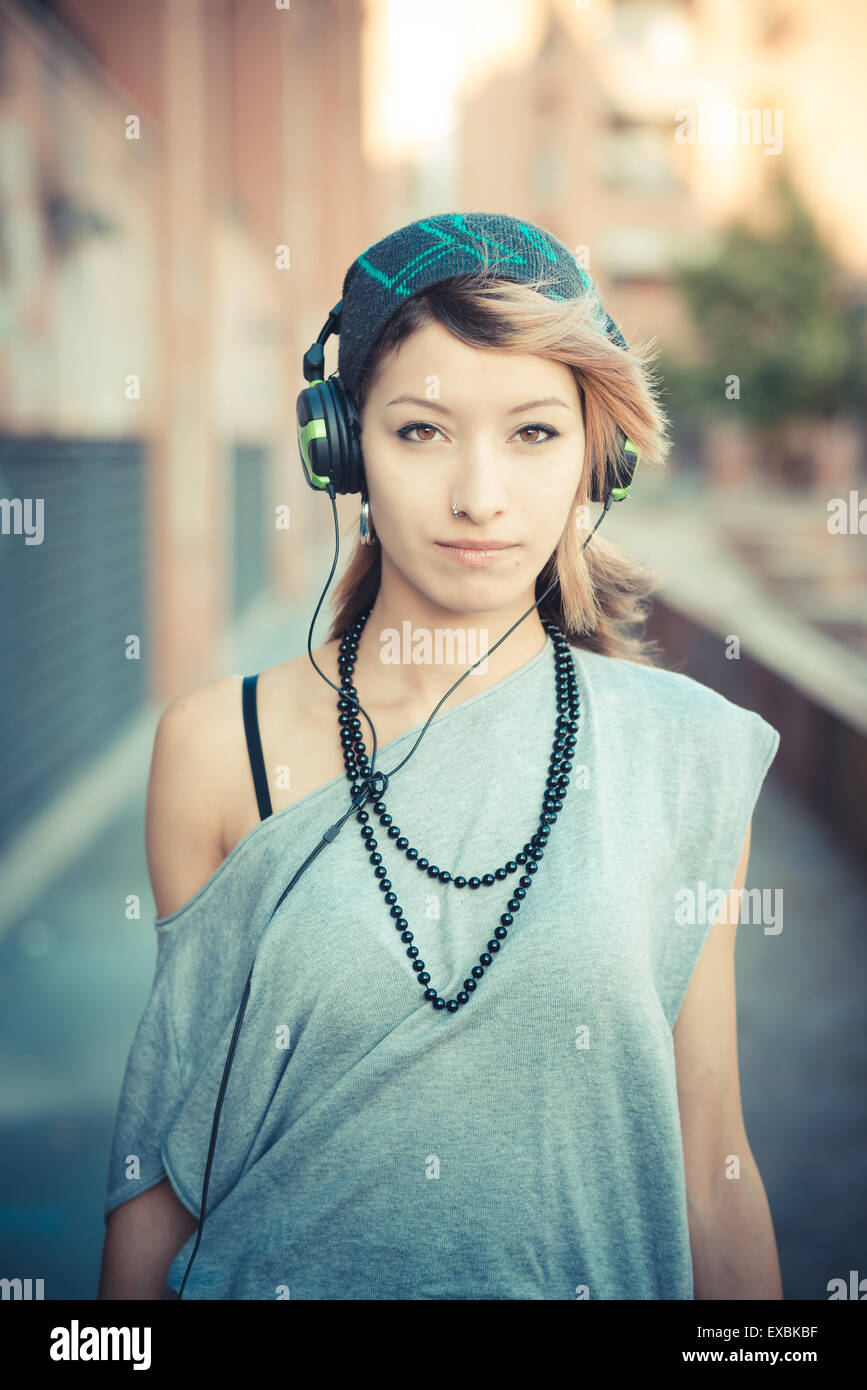 young beautiful model woman listening music in the city Stock Photo - Alamy
