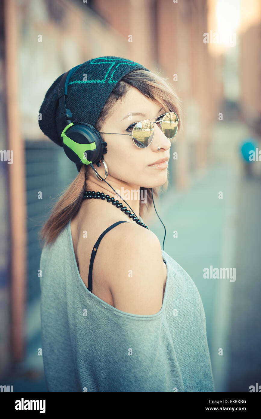 young beautiful model woman listening music in the city Stock Photo - Alamy