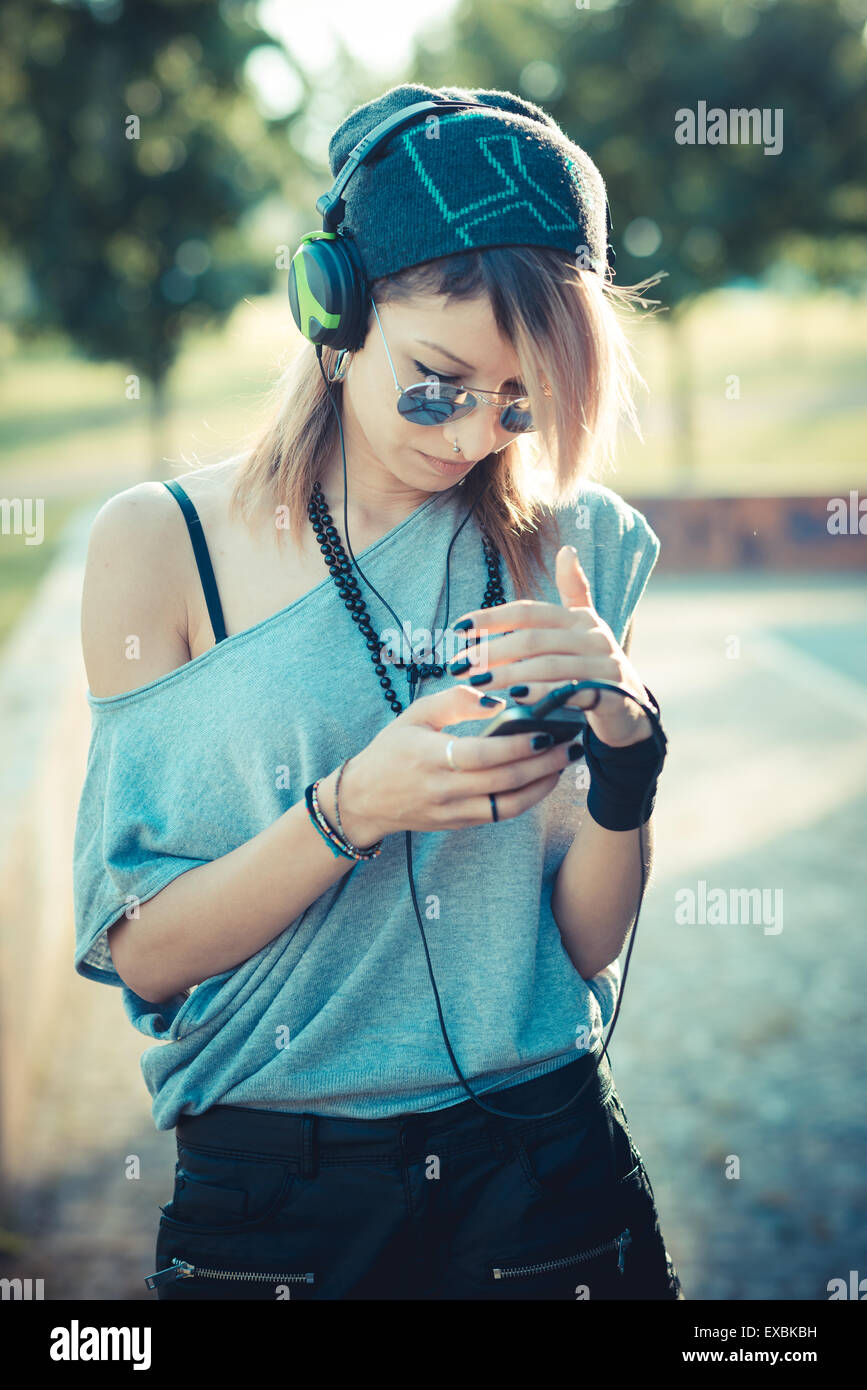 young beautiful model woman listening music in the city Stock Photo - Alamy