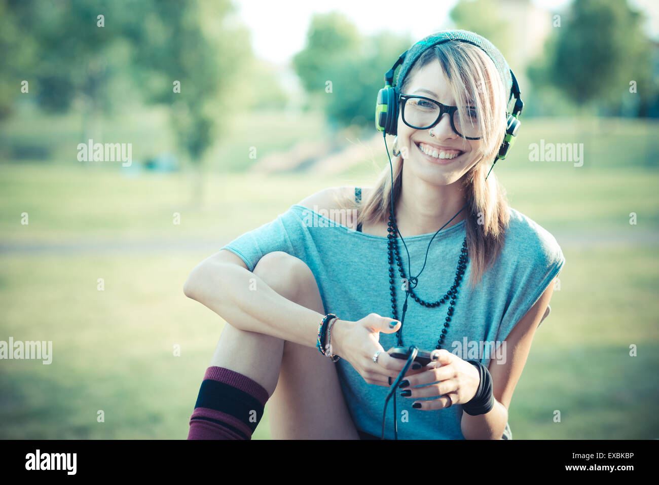 young beautiful model woman listening music in the city Stock Photo - Alamy