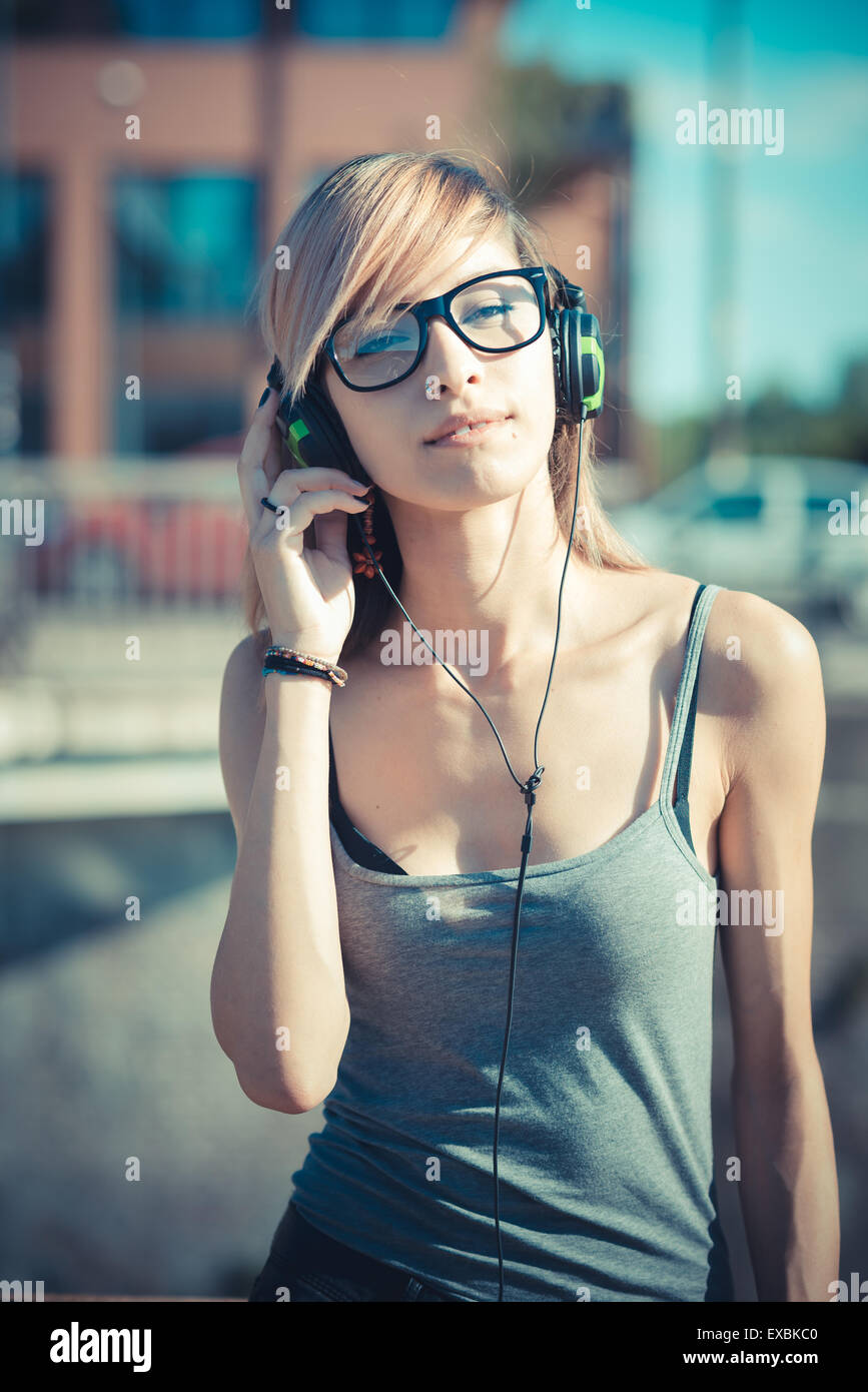 young beautiful model woman listening music in the city Stock Photo - Alamy