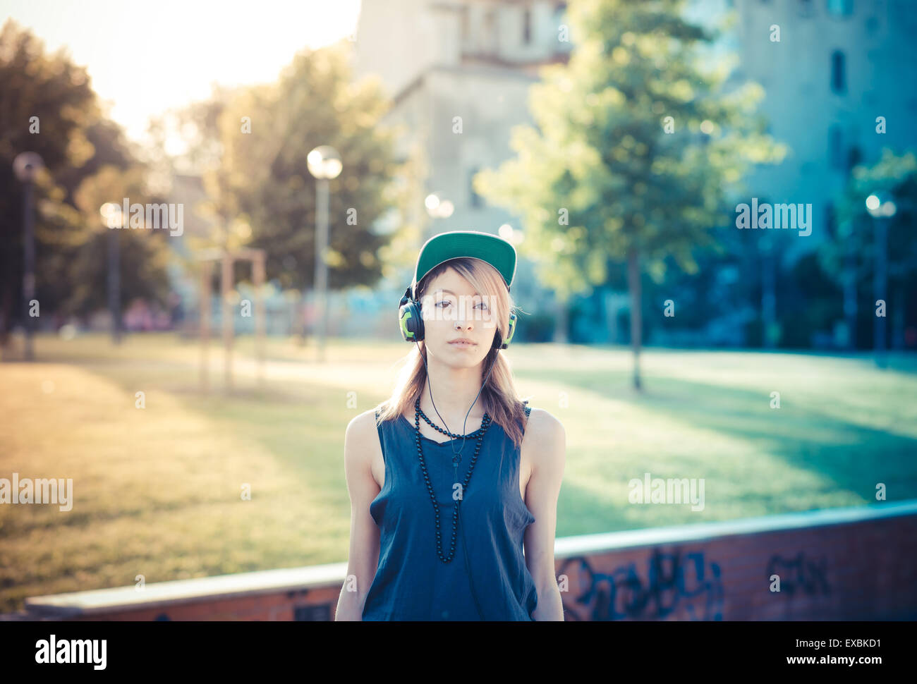 young beautiful model woman listening music in the city Stock Photo - Alamy