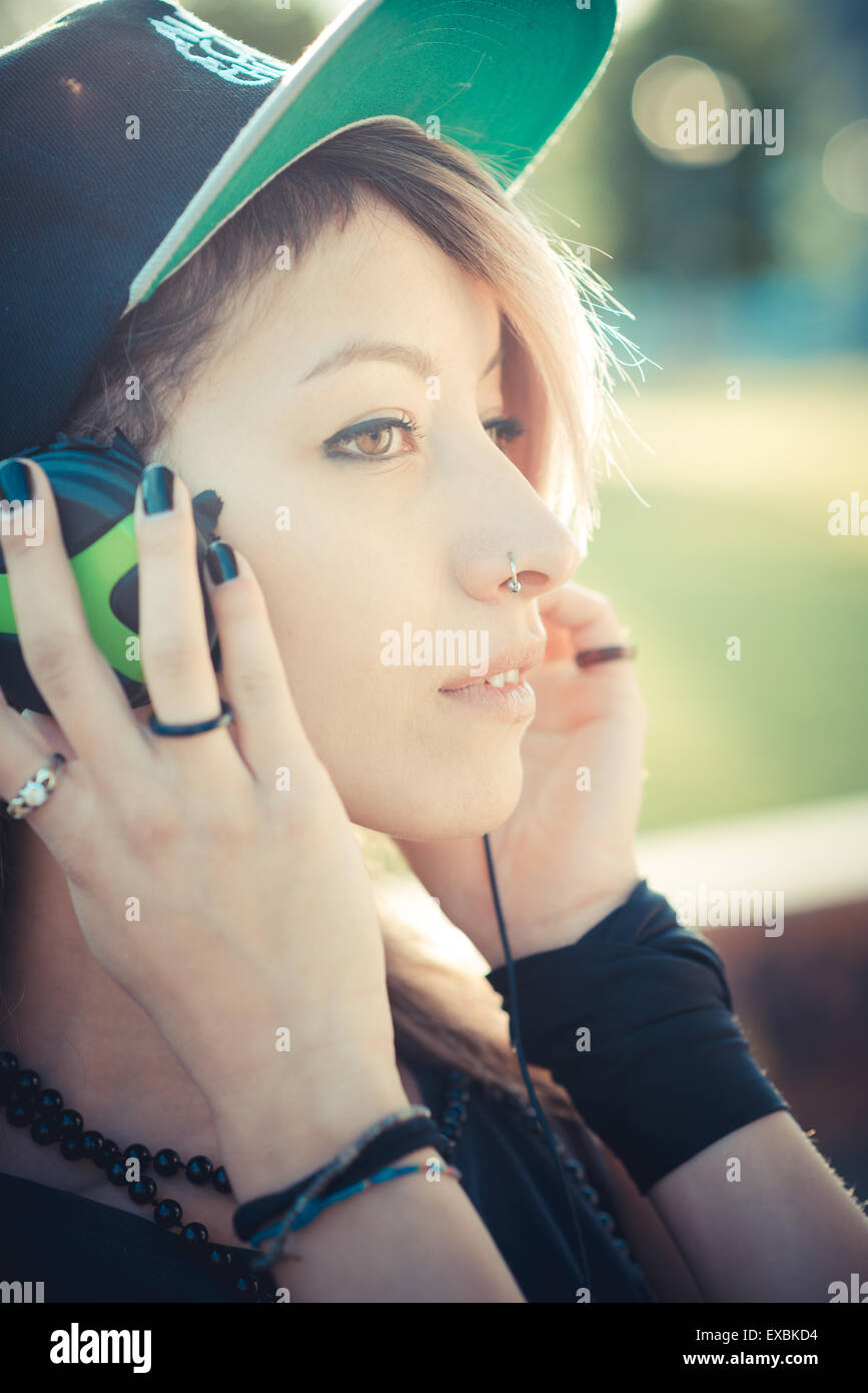 young beautiful model woman listening music in the city Stock Photo - Alamy