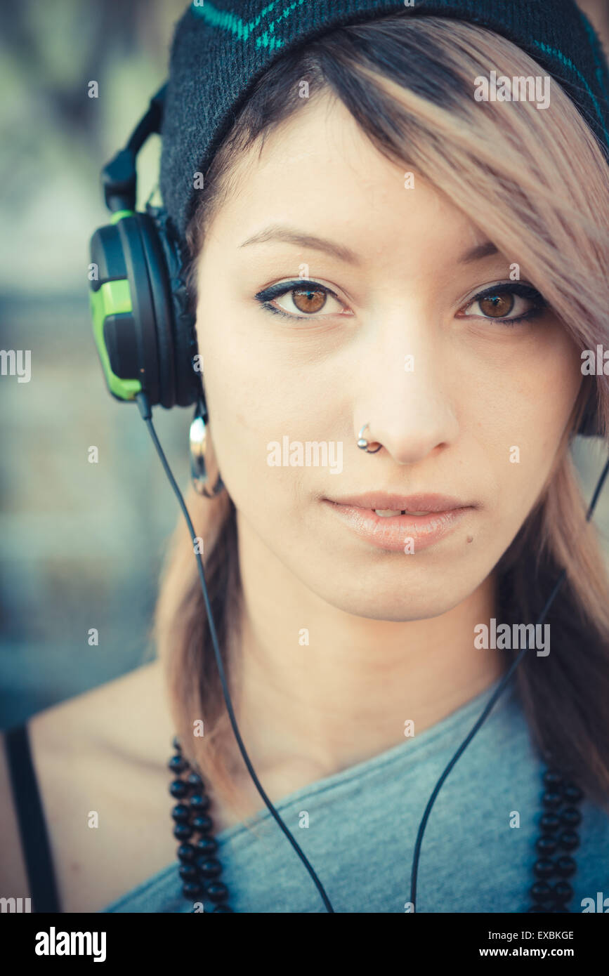 young beautiful model woman listening music in the city Stock Photo - Alamy