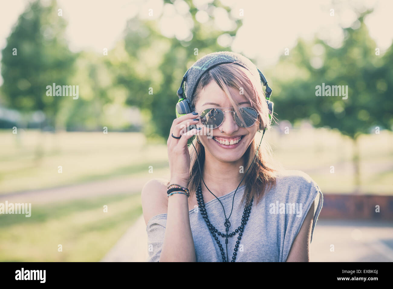 young beautiful model woman listening music in the city Stock Photo - Alamy