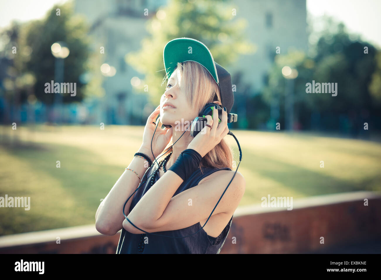 young beautiful model woman listening music in the city Stock Photo - Alamy