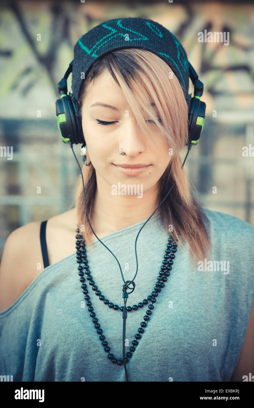 young beautiful model woman listening music in the city Stock Photo - Alamy